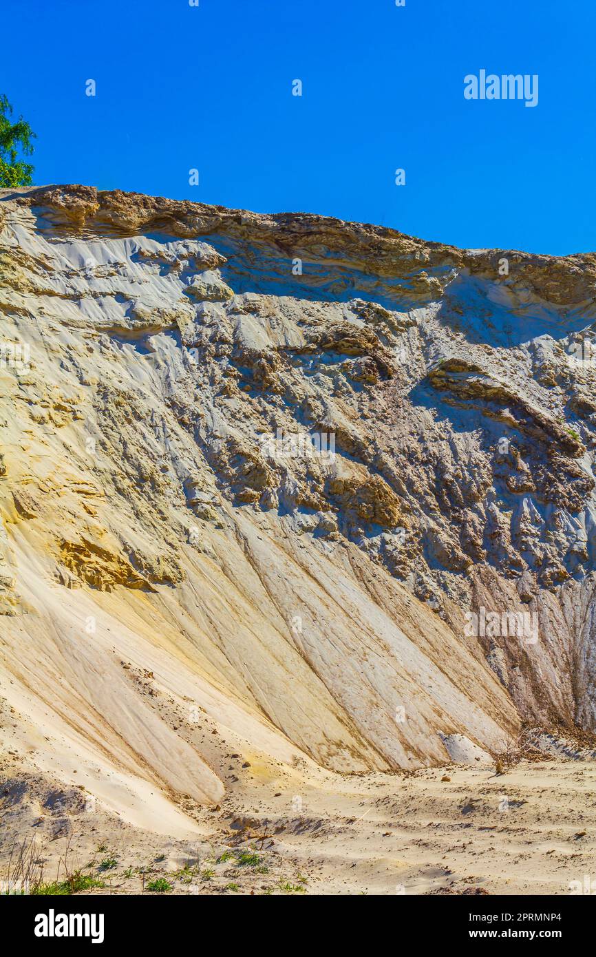 Excavated sand mountains and rubble piles quarry lake dredging pond ...