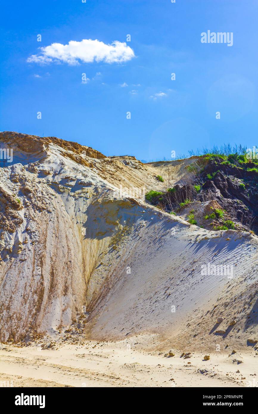 Excavated sand mountains and rubble piles quarry lake dredging pond ...