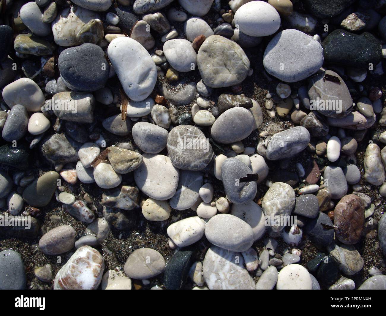Pebble texture on a the Aegean coast in Greece Stock Photo - Alamy