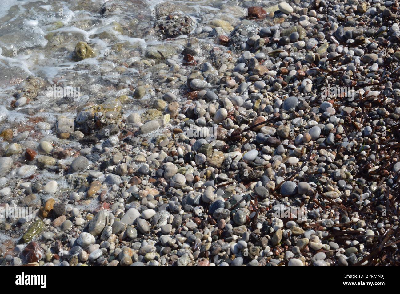 Pebble texture on a the Aegean coast in Greece Stock Photo - Alamy