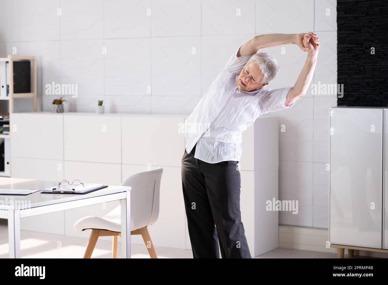 Stretching Office Workout. Desk Stretch Exercise Stock Photo - Alamy