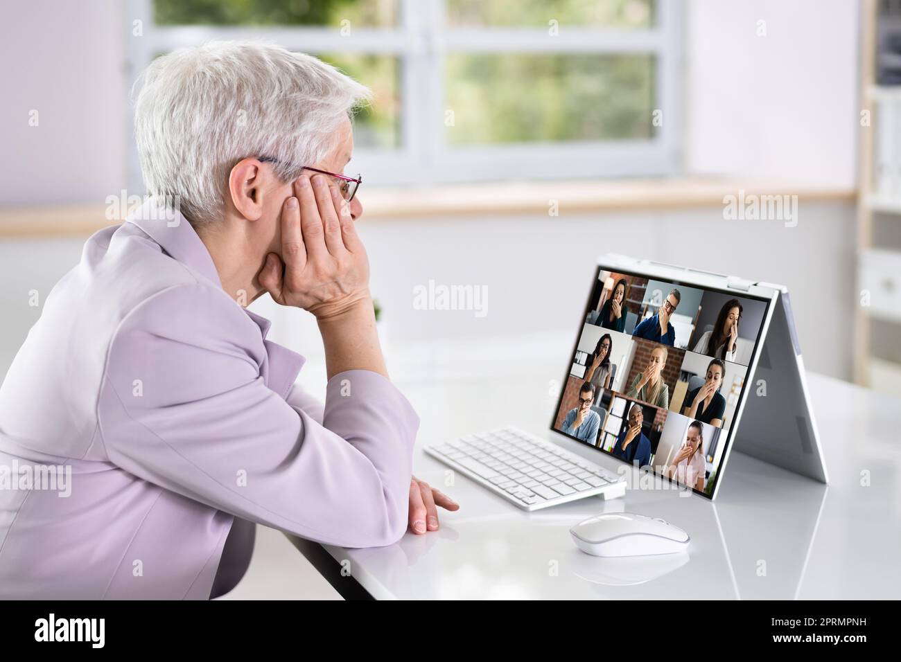 Bored Employee In Video Conference Training Stock Photo - Alamy