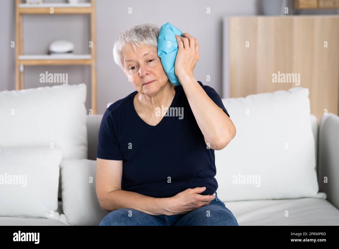 Woman's Hand Applying Ice Gel Pack Stock Photo - Alamy