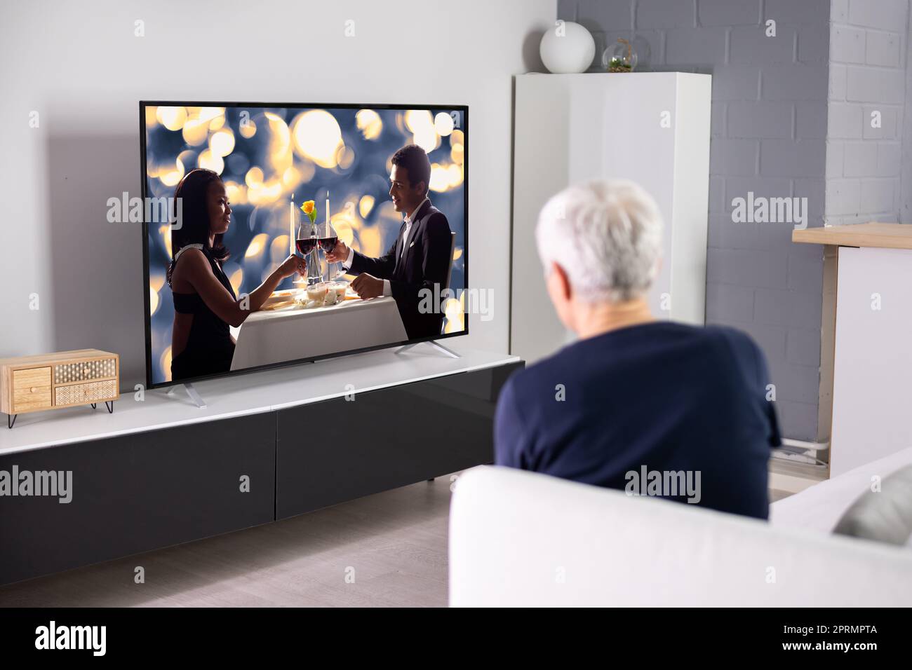 Elderly lady watching tv hi-res stock photography and images - Alamy