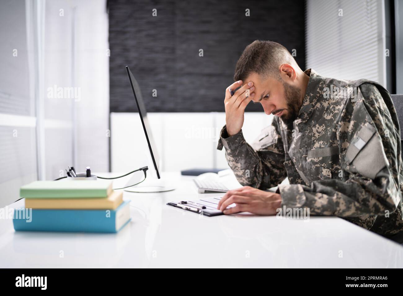Sad Frustrated Military Veteran Student Doing Test Stock Photo - Alamy