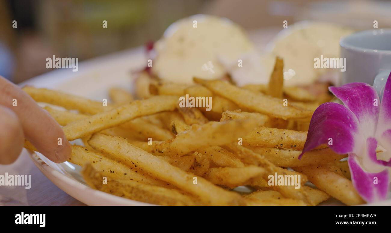 French fries on plate in restaurant Stock Photo - Alamy