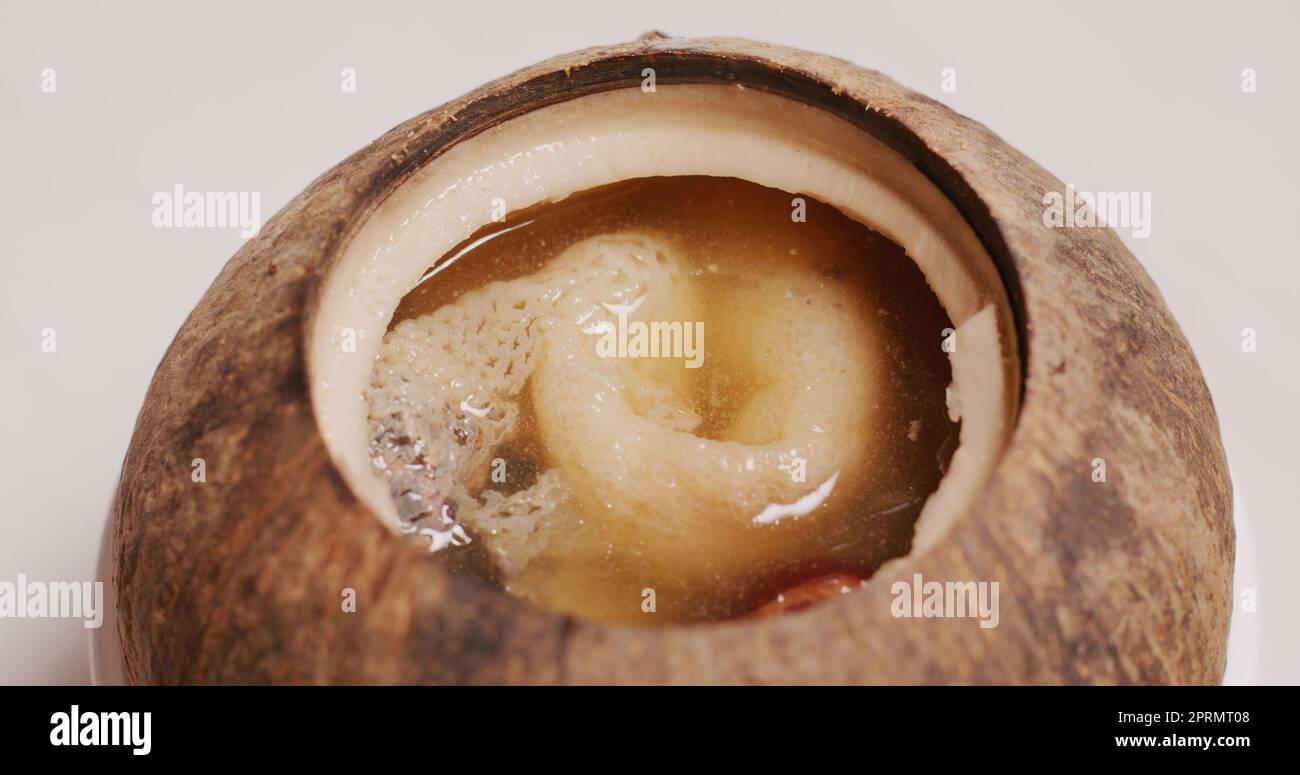 Chinese chicken soup inside coconut Stock Photo - Alamy