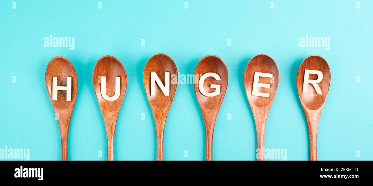 Hungry is standing in german language on the wooden spoons, food ...