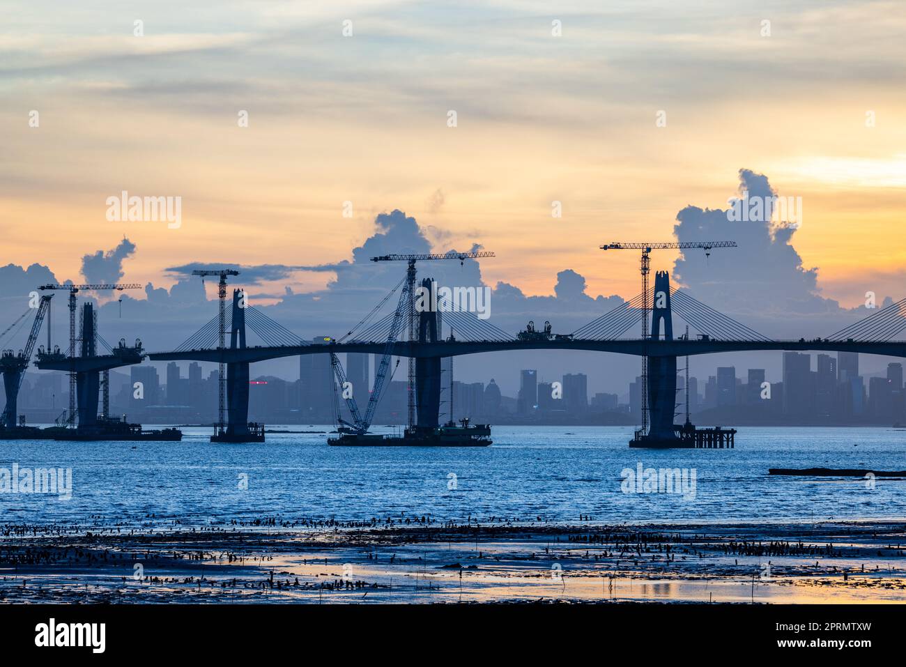 Kinmen Bridge under construction in Taiwan at sunset Stock Photo - Alamy