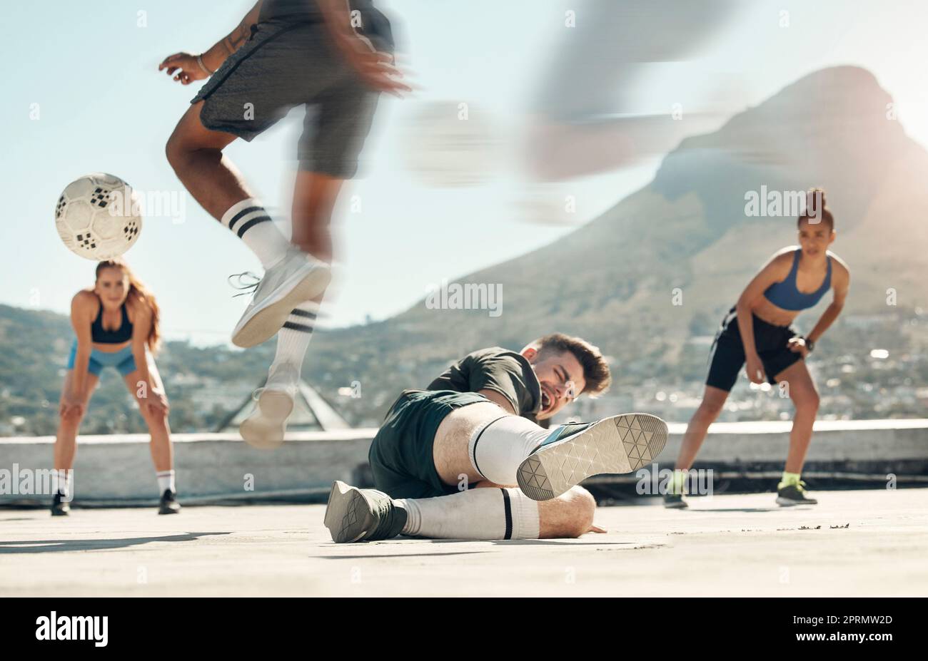 Soccer, sports and tackle with a man player sliding an opponent during ...