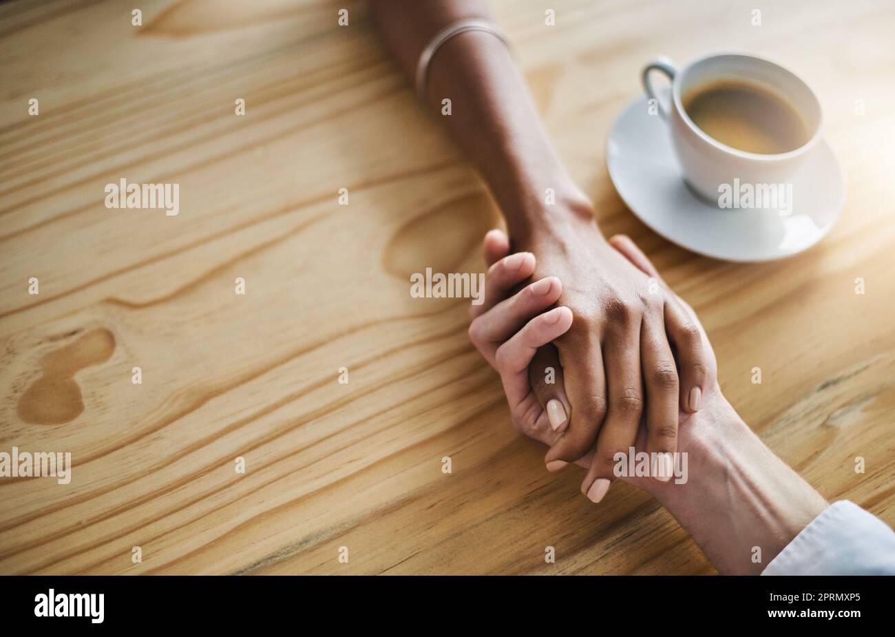 Couple holding hands sitting down hi-res stock photography and images ...
