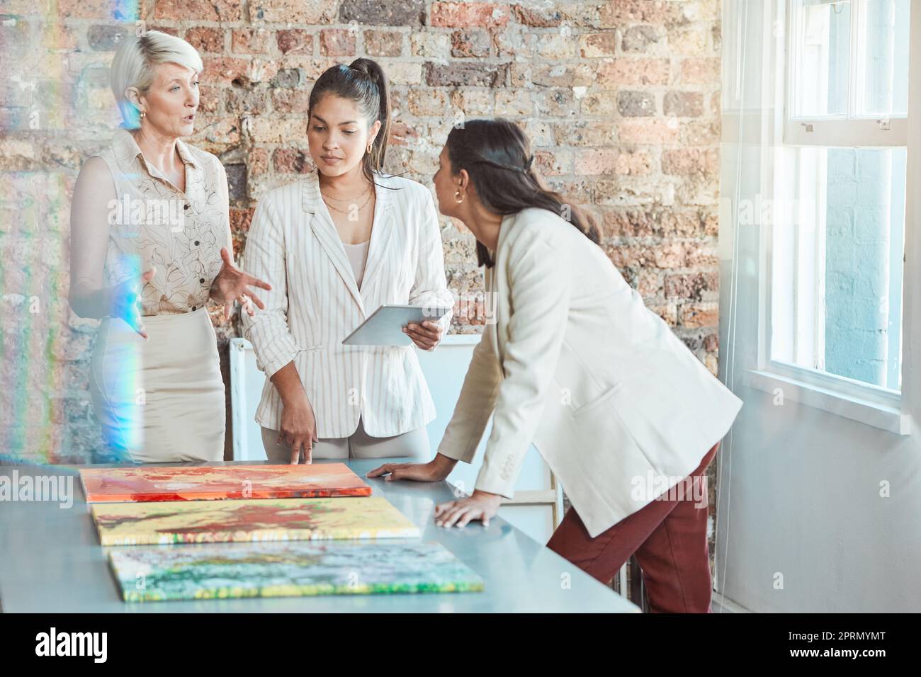 Gallery assistant looking at art hi-res stock photography and images ...