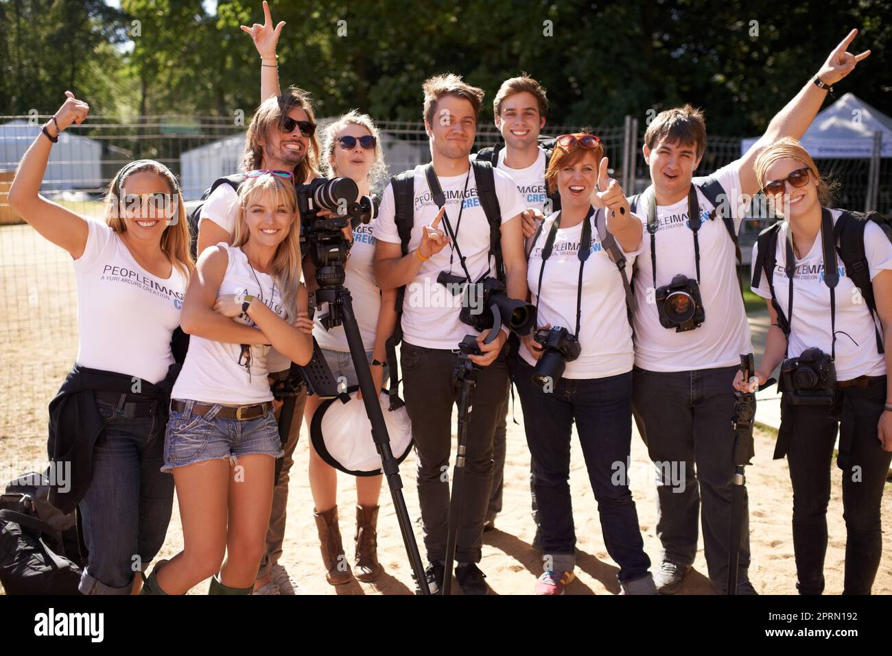 Team of fantastic photographer. Group photo of a team of happy ...