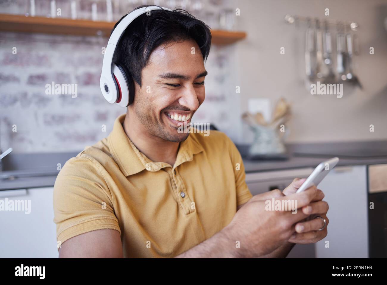 Phone, music and man on social media laughing at a funny joke on a ...