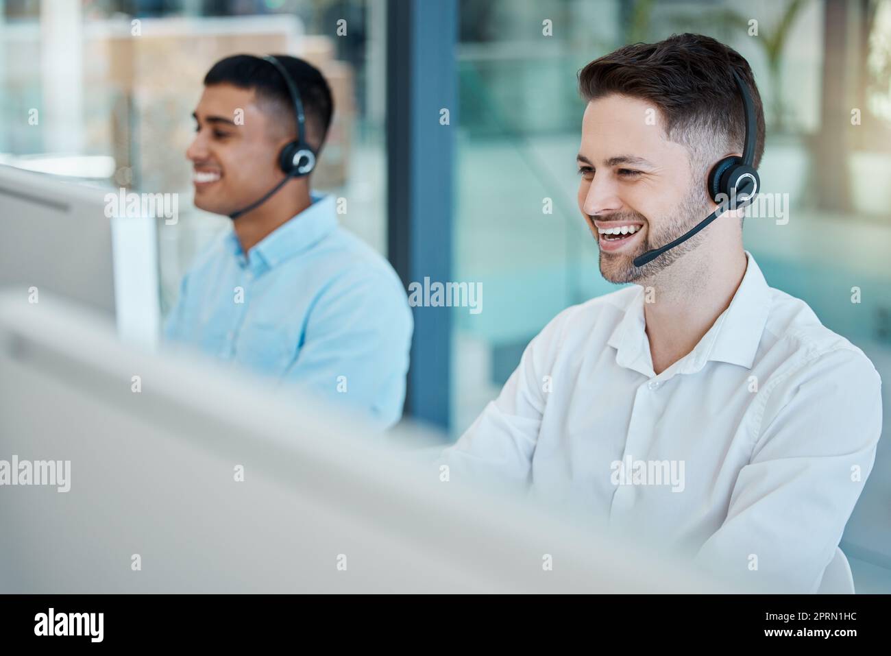 Happy call center, consultant man laugh on customer service phone call ...