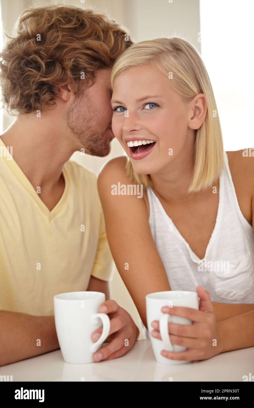 For Her Ears Only Portrait Of A Couple Sitting Together And Enjoying A