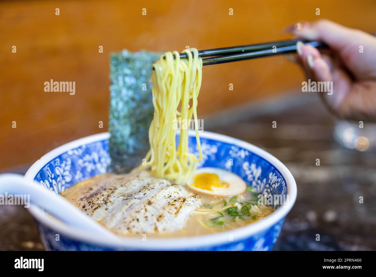 Grilled fish soup Japanese ramen bowl Stock Photo - Alamy