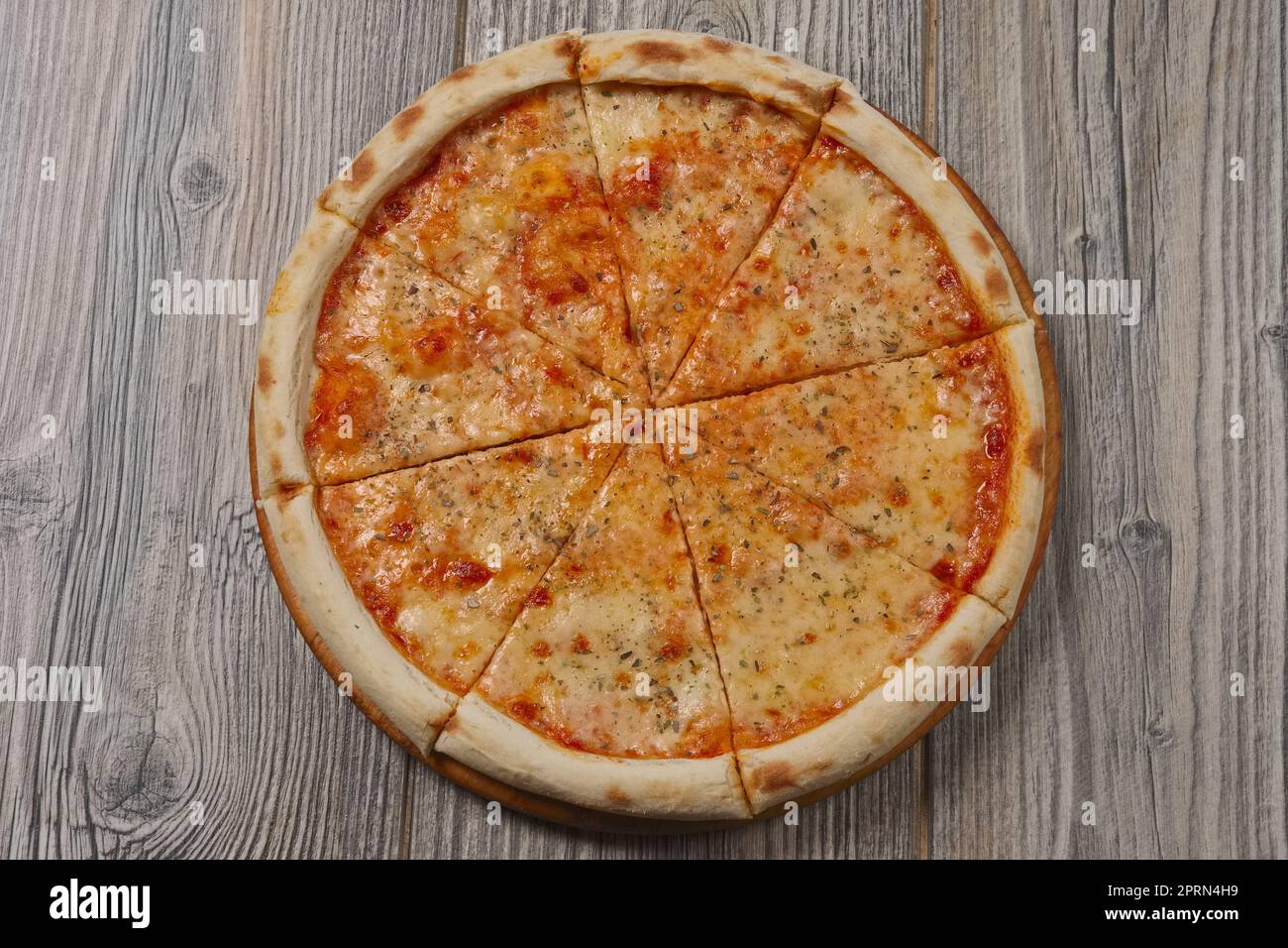 Pizza margherita cuted on pieces. Top view Stock Photo - Alamy