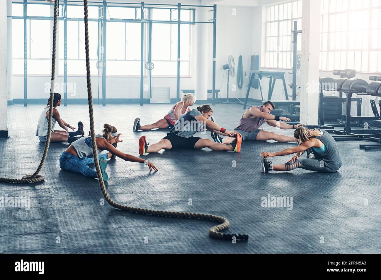 Stretching and getting in shape. an accountability group working out at ...