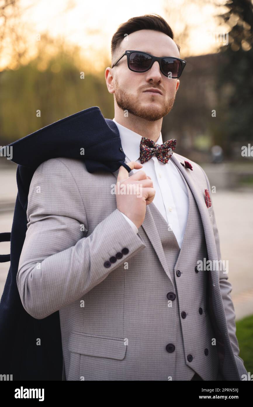 beautiful portrait of a charming leading showman in a stylish suit ...