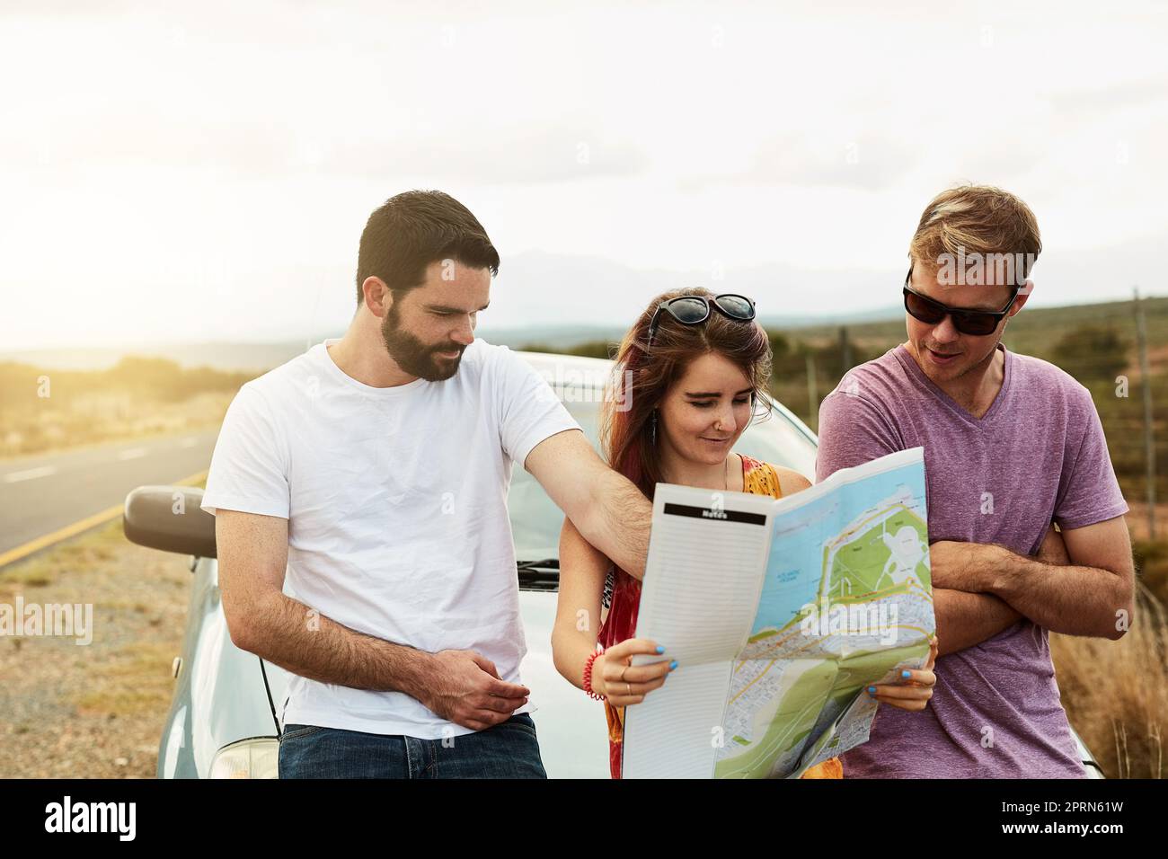 I think this will be the shortest route. a group young friends holding ...