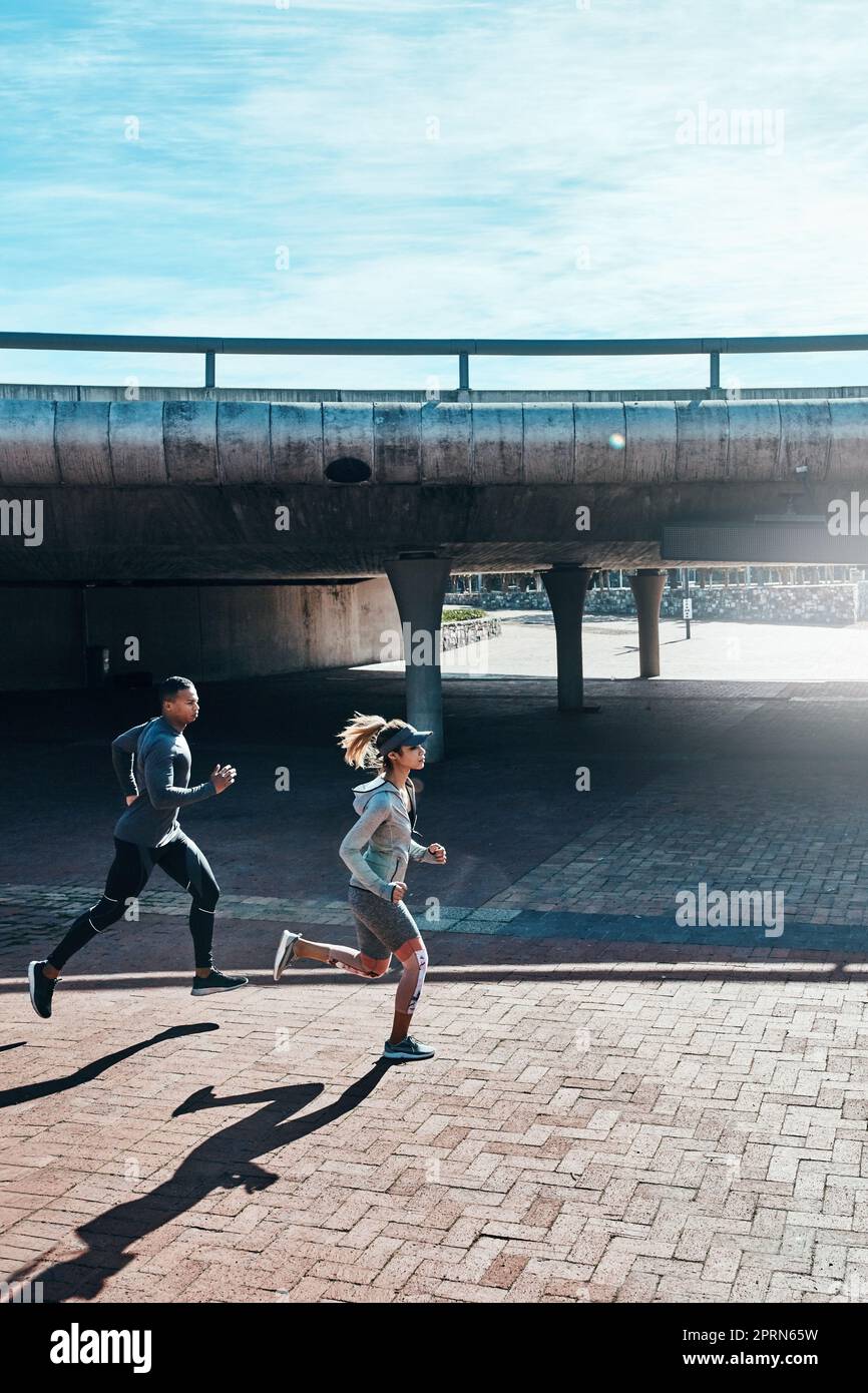 Leading a physically active lifestyle together. Full length shot of two ...