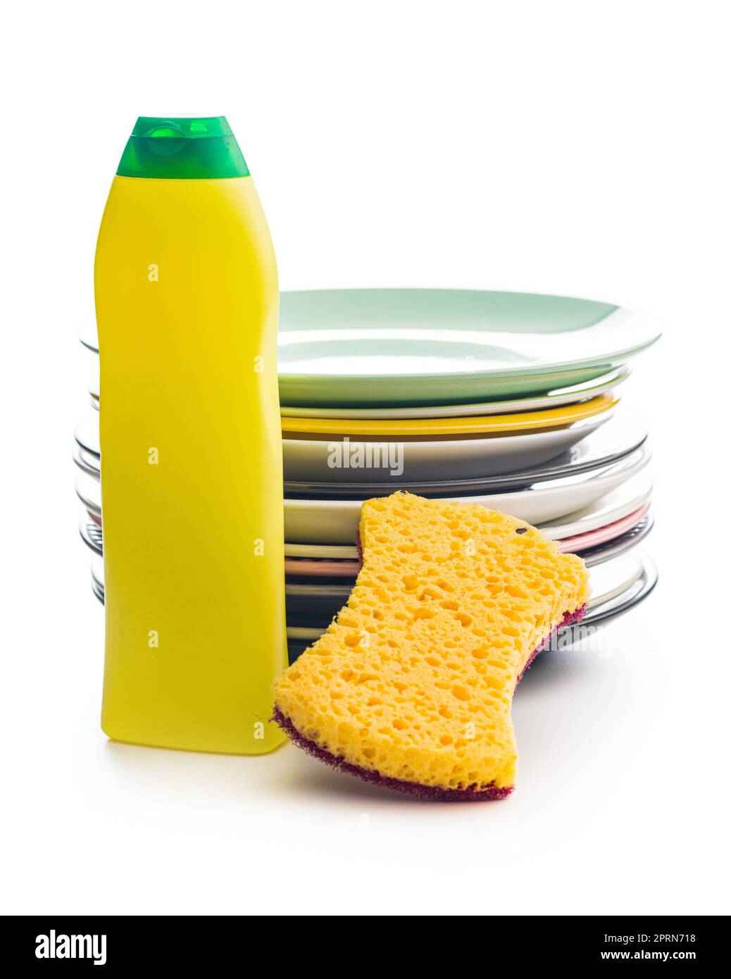 Sponge for washing dishes, plastic bottle and plates isolated on the ...