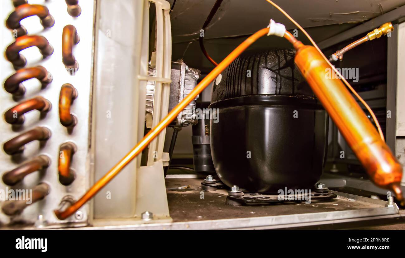 Repair of the engine of an industrial refrigerator unit. Refrigerator ...