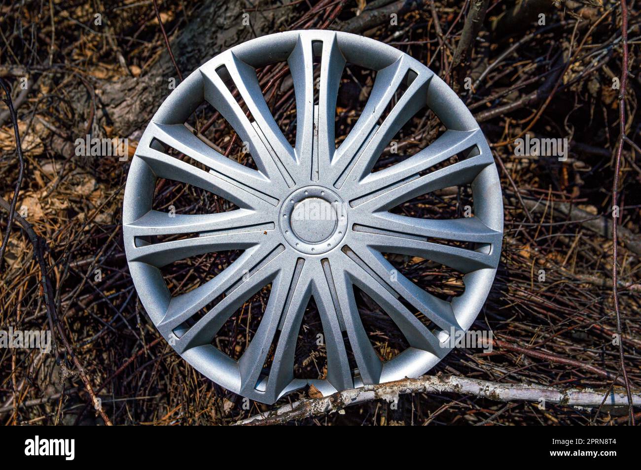 Silver plastic car wheel rim cap. Part of a car wheel. Detail of the ...