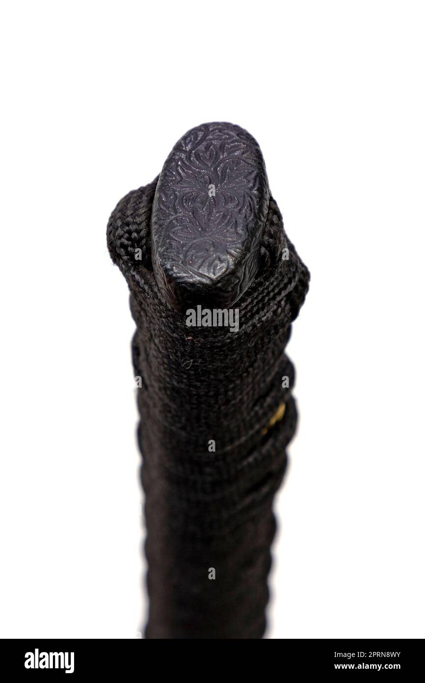 Close up the Kashira: butt cap (or pommel) made of steel on the end of ...