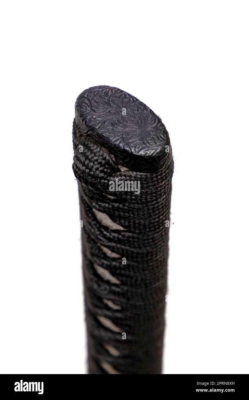 Close up the Kashira: butt cap (or pommel) made of steel on the end of ...