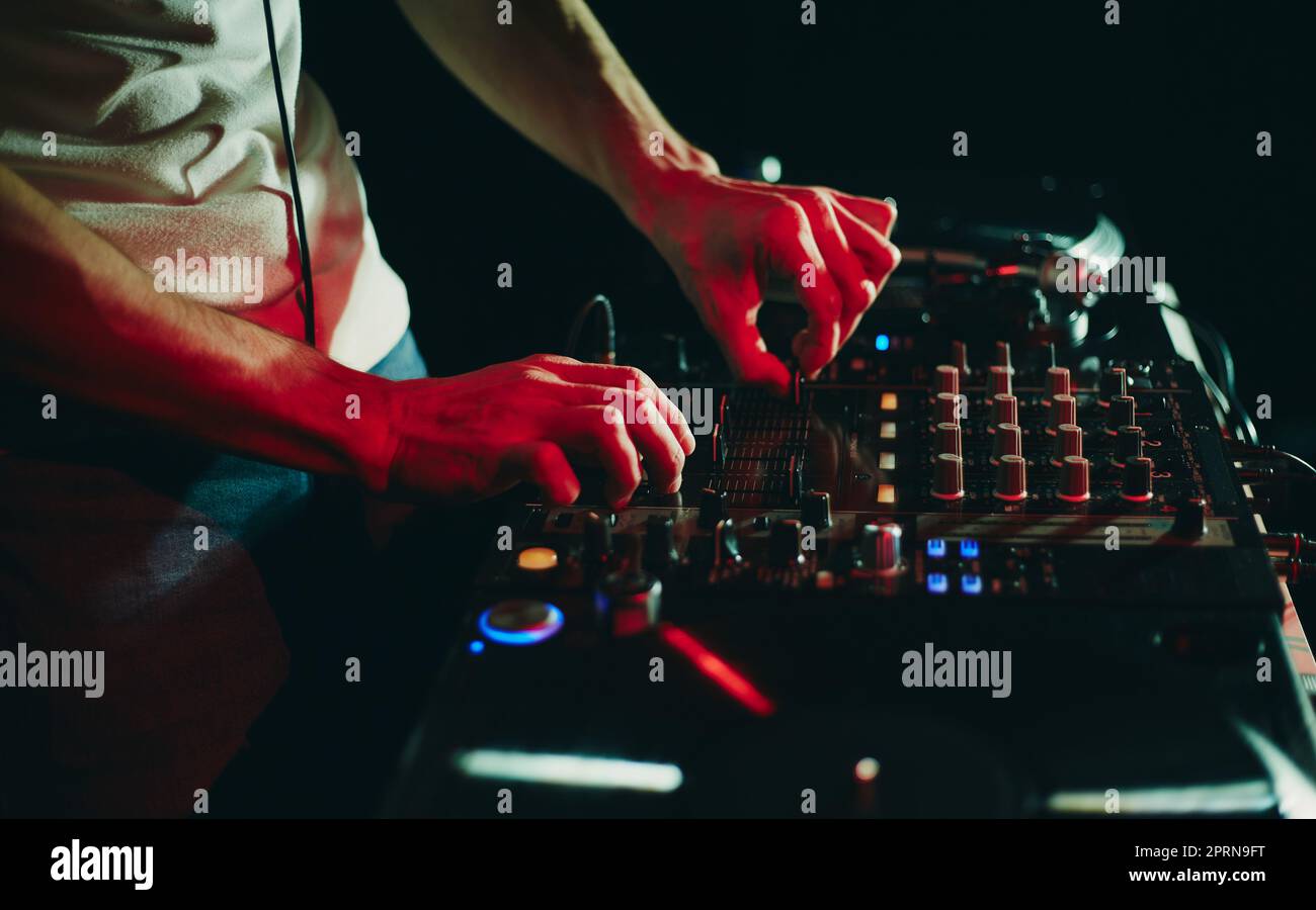 Professional disc jockey playing music set with sound mixer and vinyl ...