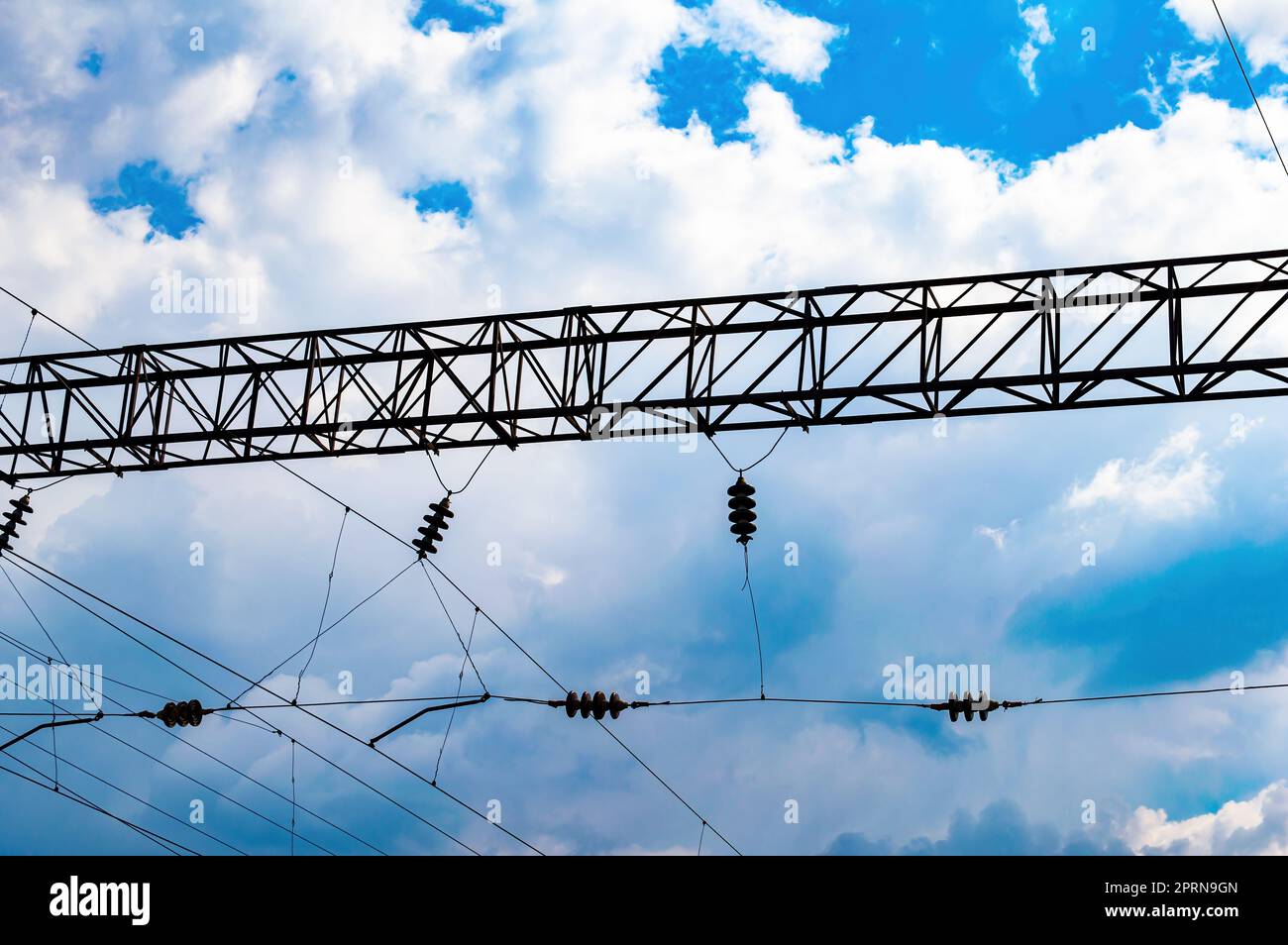 Iron mast with high voltage electric power wires of the railway. Railway. Transport ...