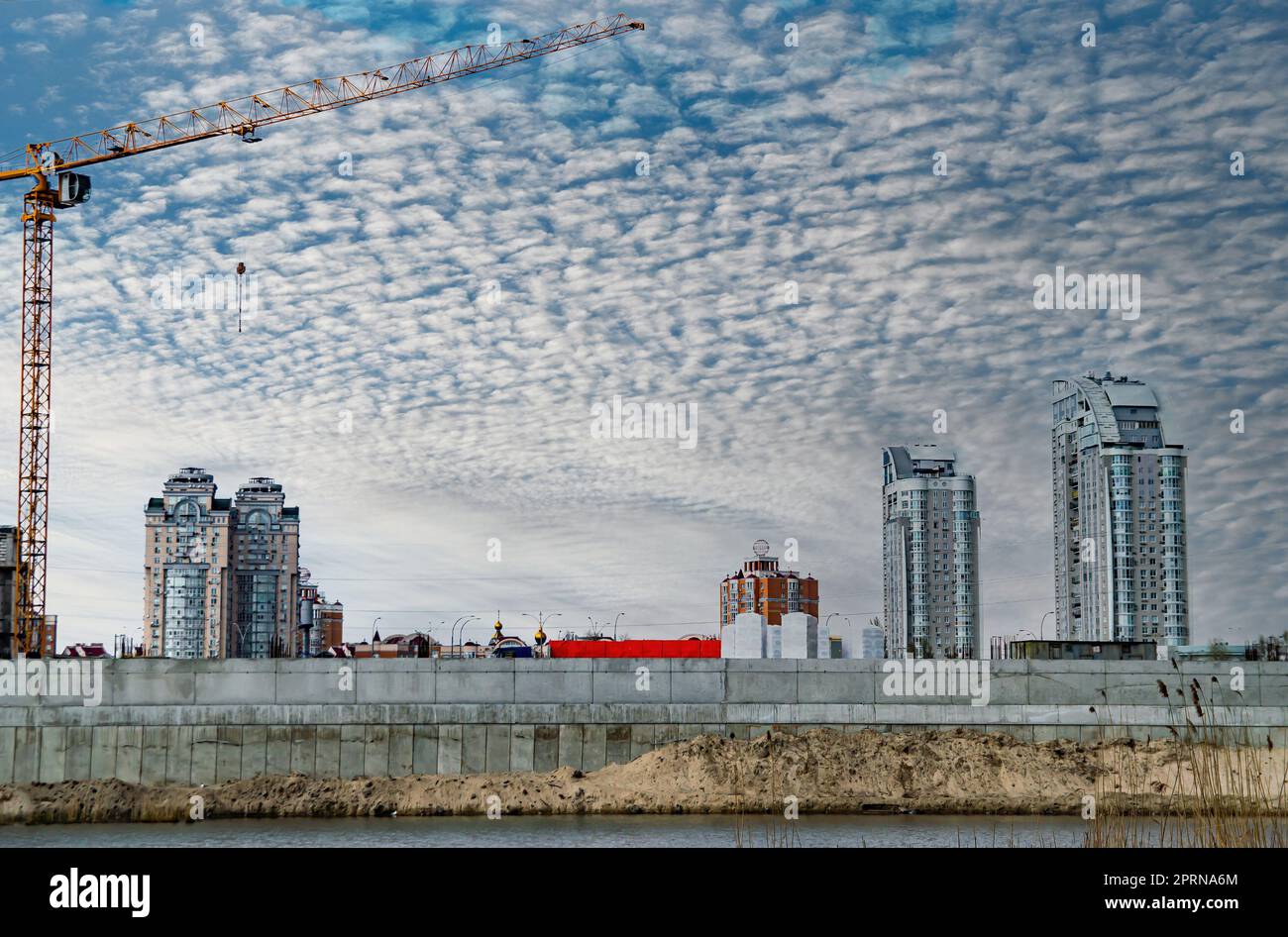 Mounting high-rise crane at a construction site. Building bussiness ...