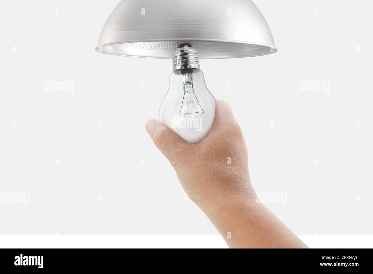 closeup hand changing an electric light bulb Stock Photo - Alamy