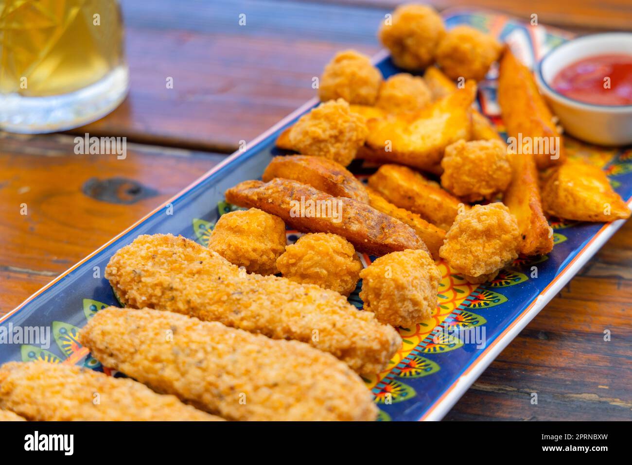 Fry fish finger and potato wedges Stock Photo - Alamy