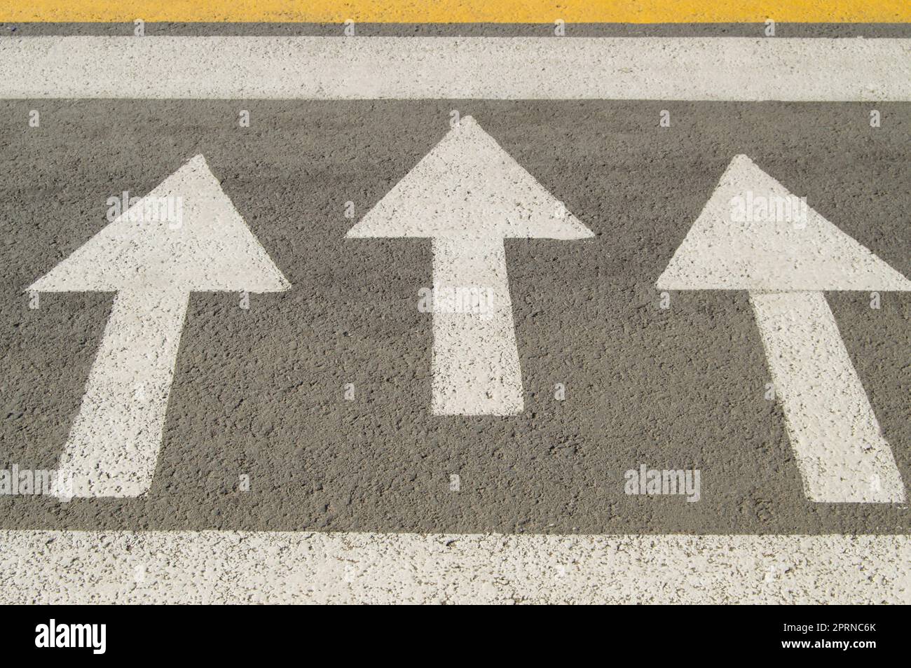 Asphalt road with arrow sign shows the direction of movement Stock ...