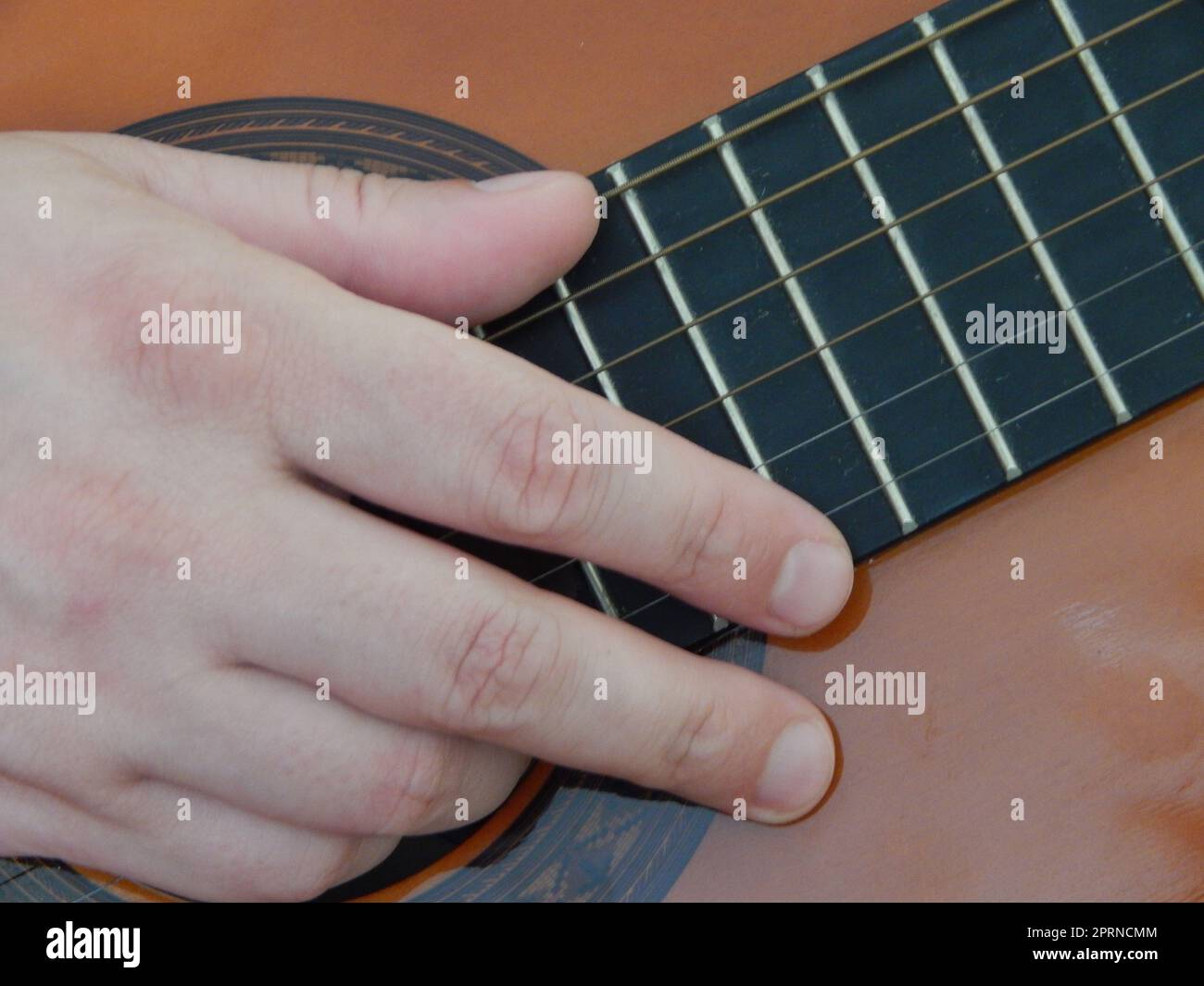 Playing hands on guitar music Stock Photo - Alamy