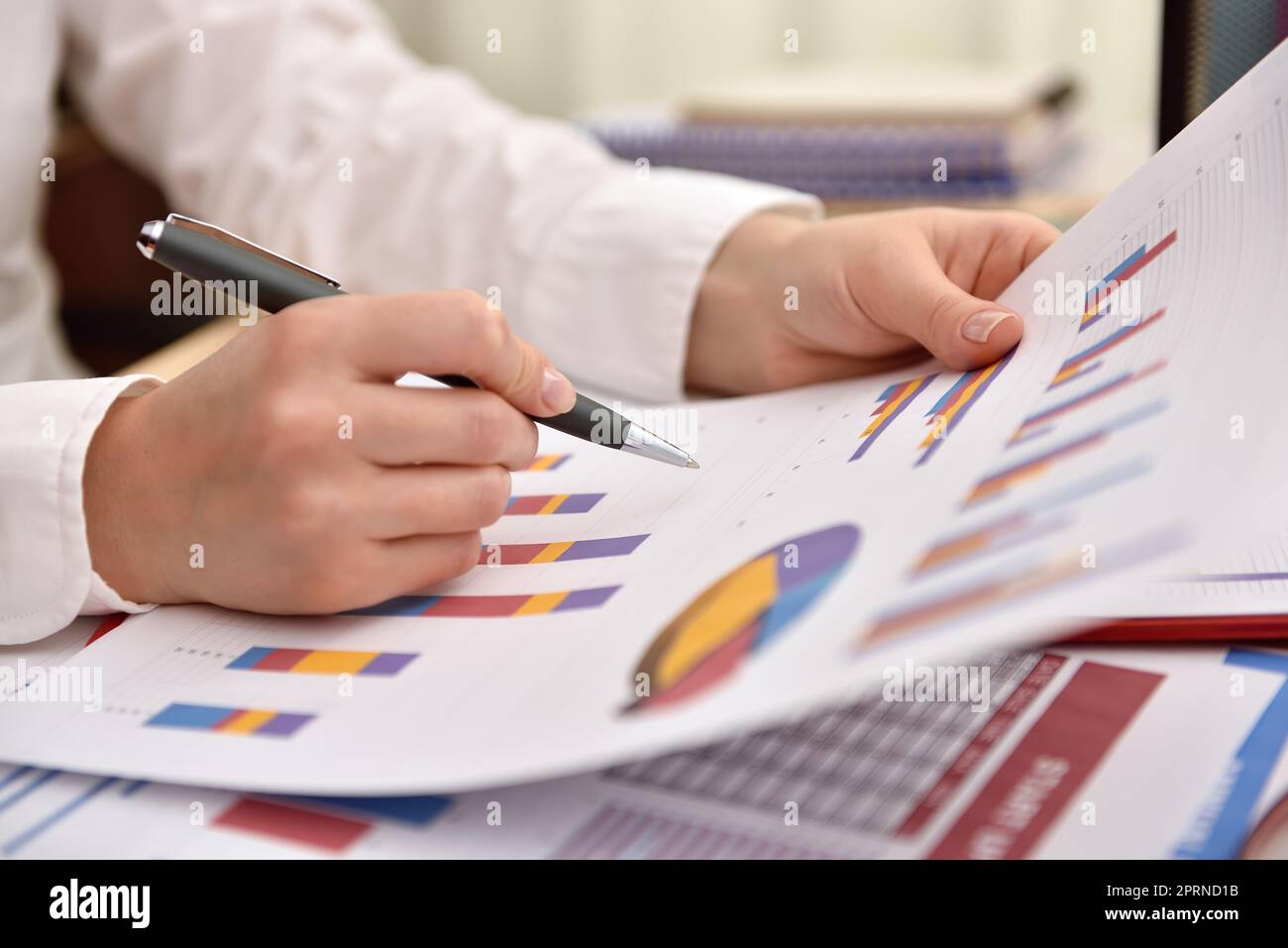Trader woman hand working with business graph and analysis chart ...