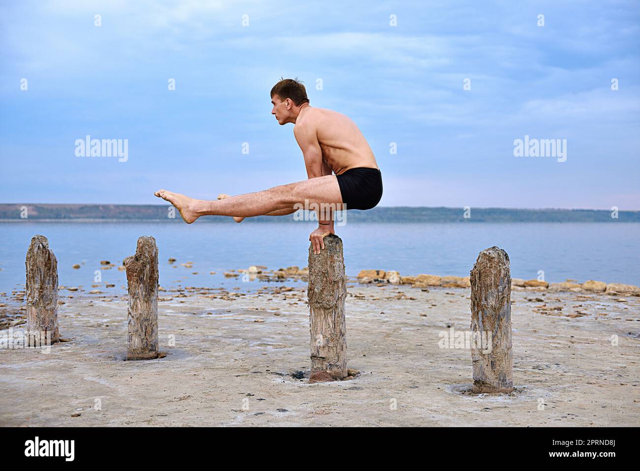 Yoga man going yoga pose Stock Photo - Alamy