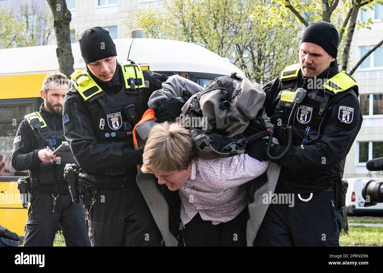 Berlin, Germany. 27th Apr, 2023. Police officers temporarily arrest an ...