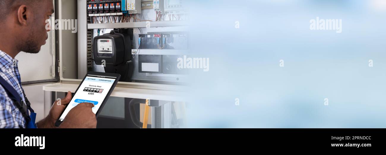 Technician Reading Electric Meter. Electrician Looking At Counter Stock ... Technician Reading Electric Meter. Electrician Looking At Counter Stock ...
