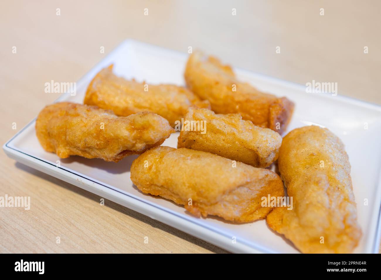 Fry fish roll dish in restaurant Stock Photo - Alamy