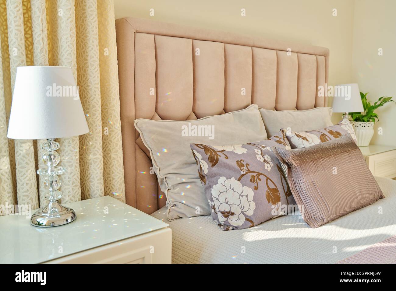 Classic bedroom interior in light ivory colors, in warm sunlight Stock ...