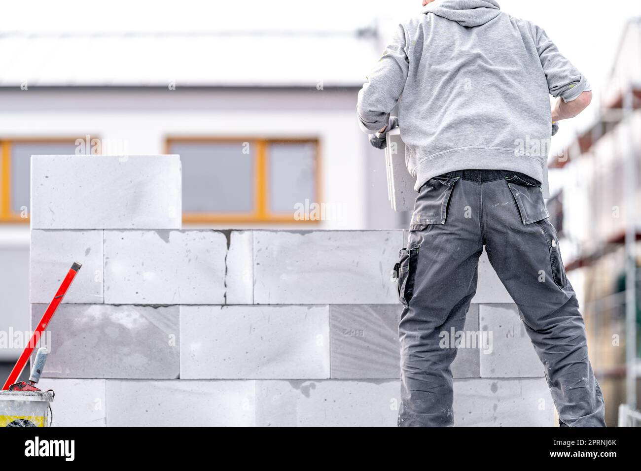 Mason builds wall from hi-res stock photography and images - Alamy