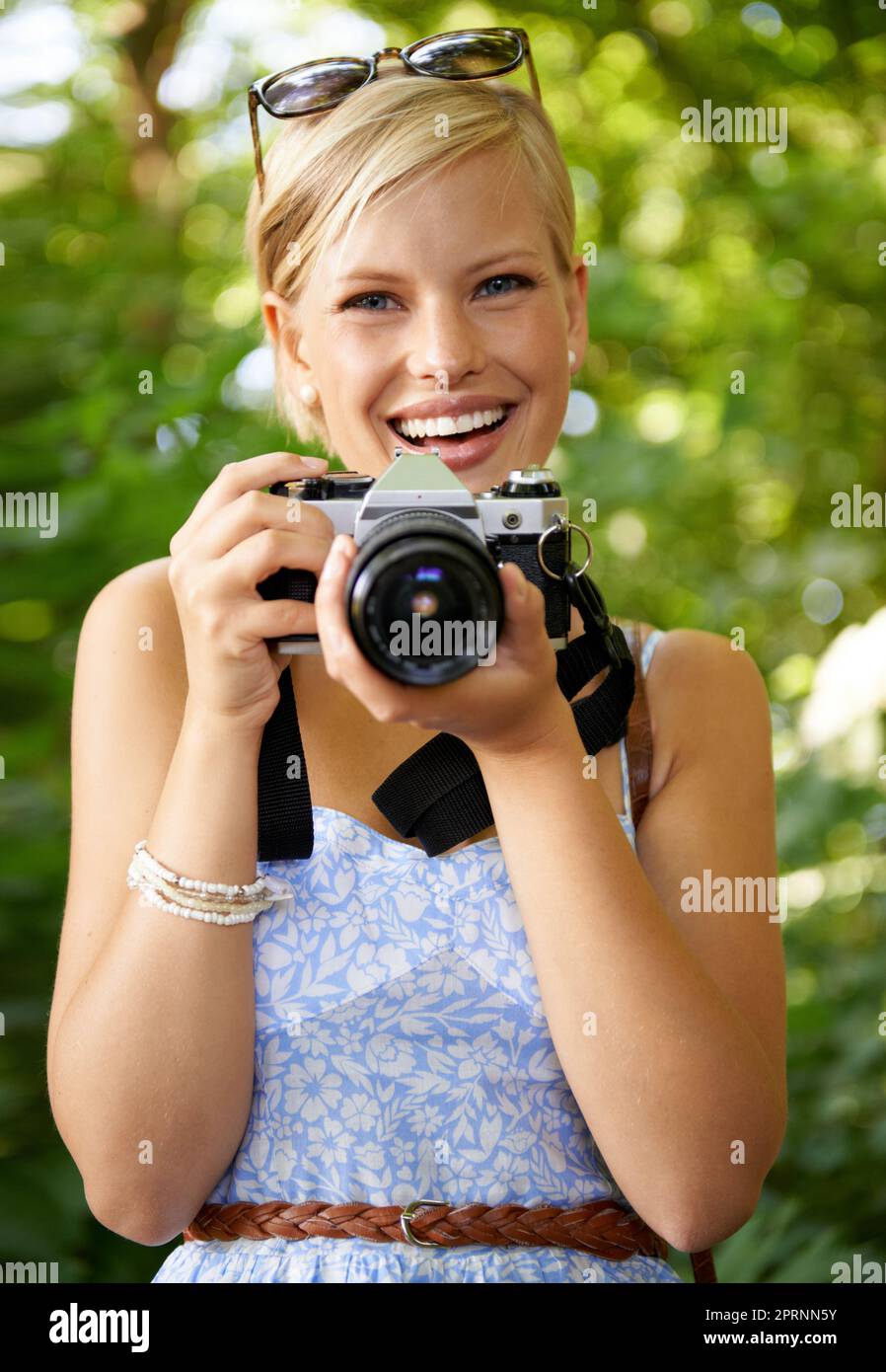 No smile more beautiful than hers. an attractive young woman taking ...