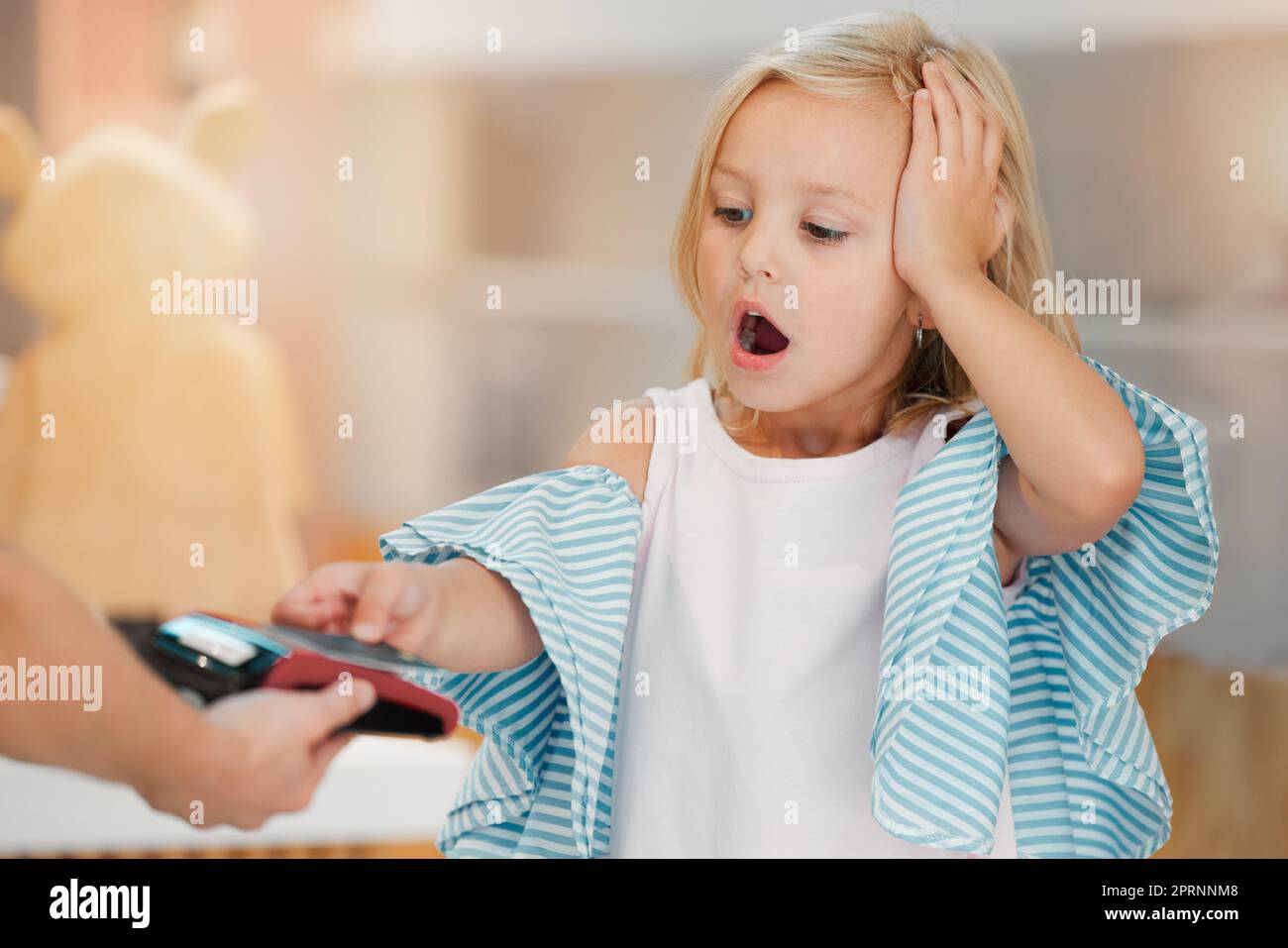 Shopping, retail and child in shock with a credit card, learning ...