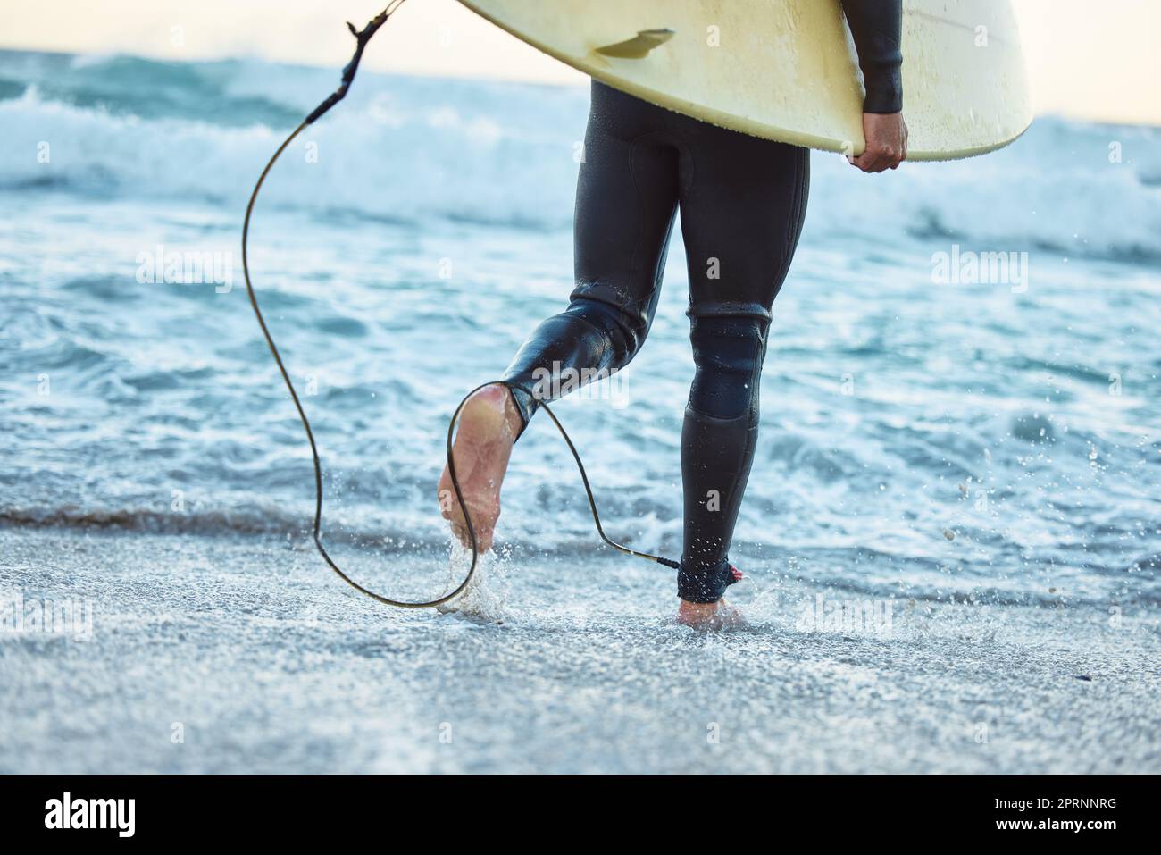 Legs, surfboard man at beach and ocean waves for fitness, adventure and ...