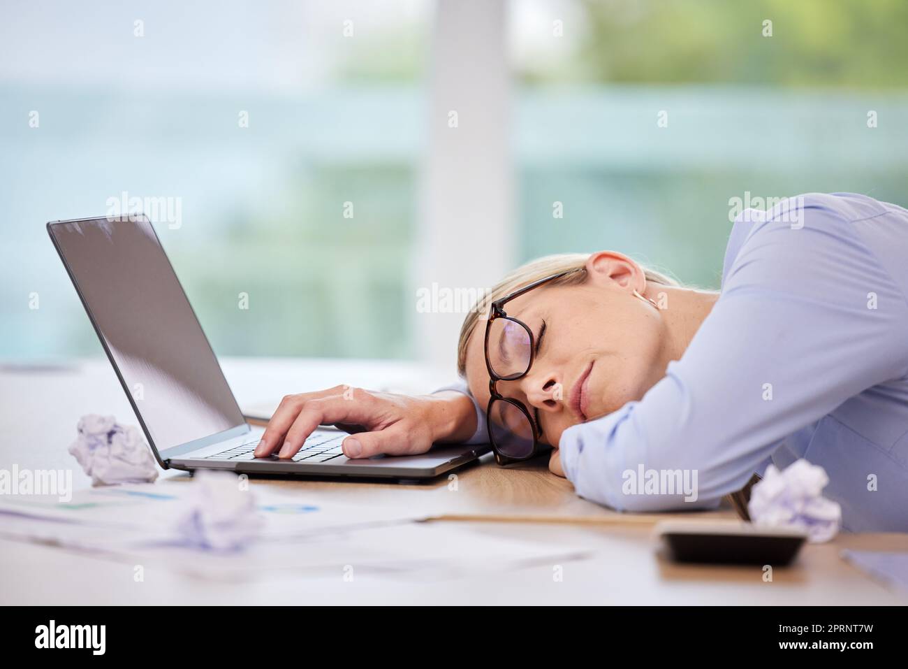 Business woman sleeping at laptop desk, burnout stress from fatigue and ...