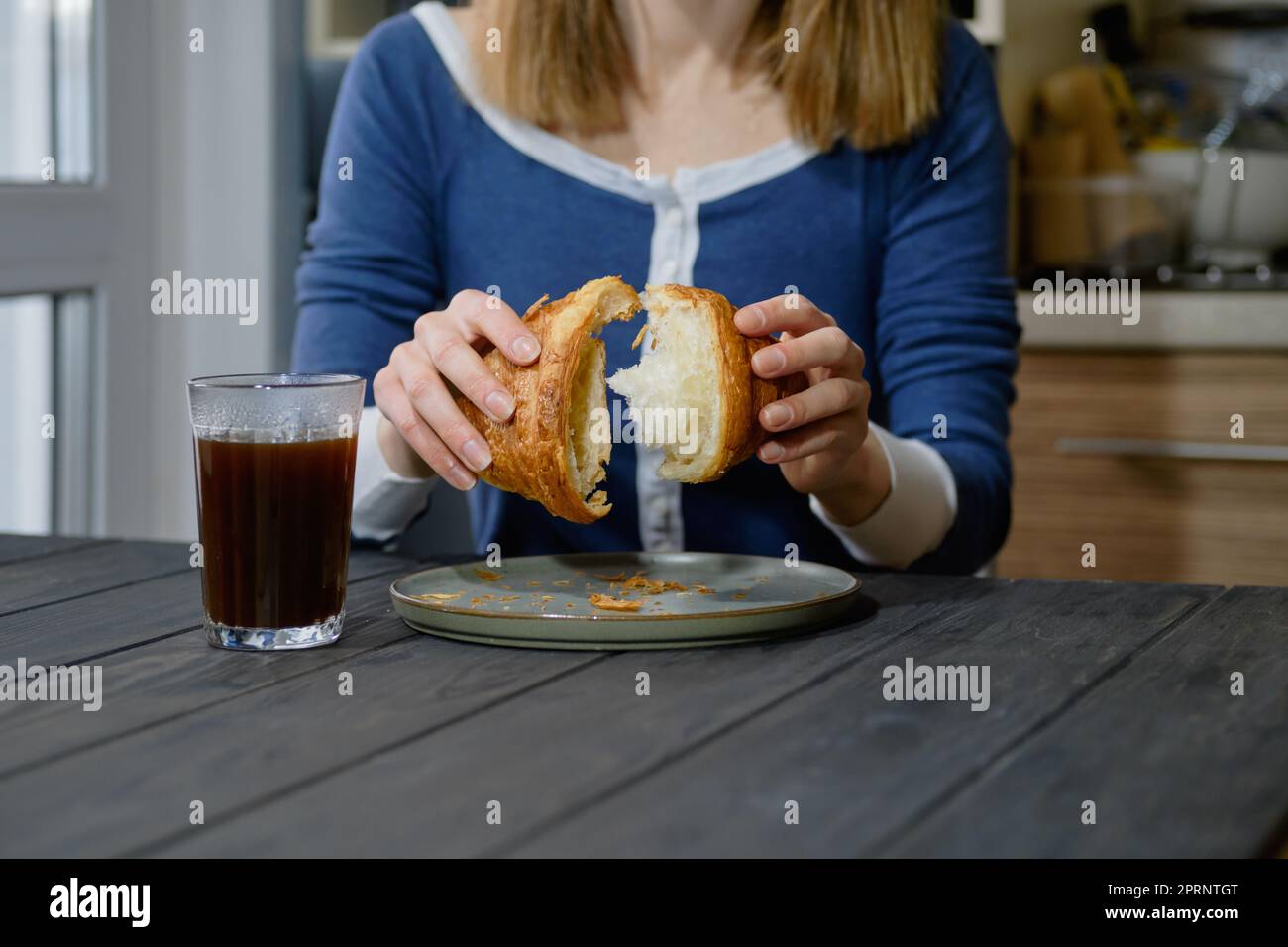 Hands tearing croissant hi-res stock photography and images - Alamy